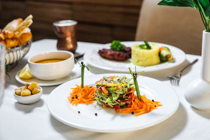 White Table with Assorted Plates of Food Stock Photo - Image of ...