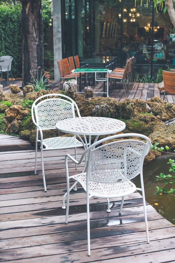 White Table and Chair Made of Metal in Coffee Shop Stock Image - Image ...