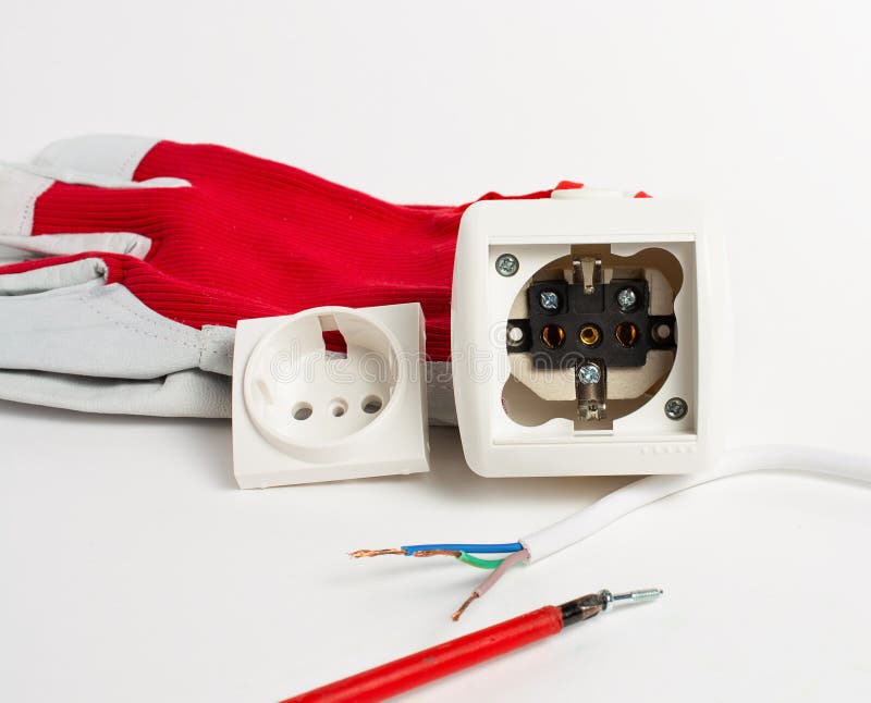 On a White Table, a Disassembled Electrical Outlet, Ready To Install ...