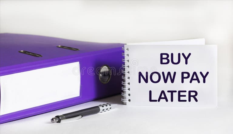 On a White Table is a Folder with Documents, a Pen and a Notepad with ...