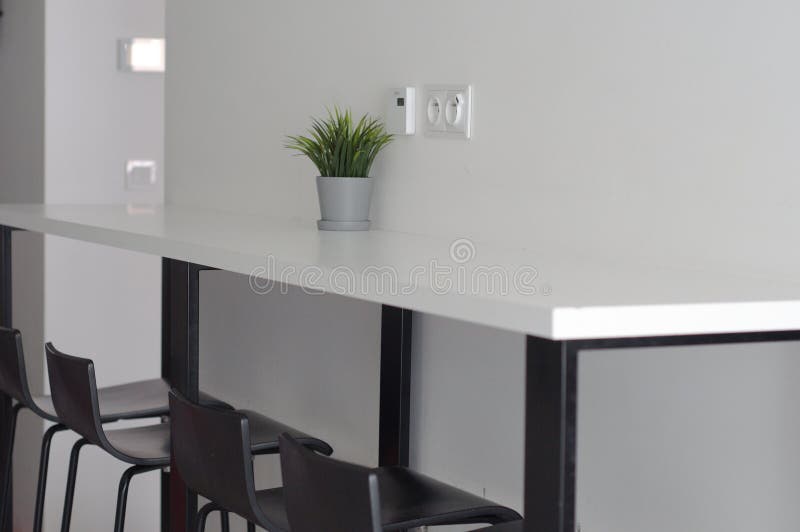 White Table-shelf in a Narrow Kitchen. Modern Interior. Black Chairs ...