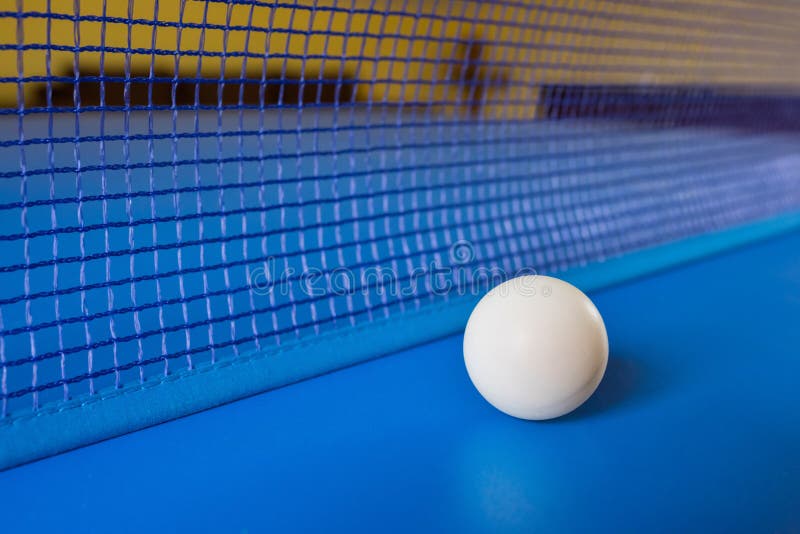 White Table Tennis Ball on Blue Table with Net. Table Tennis Stock ...