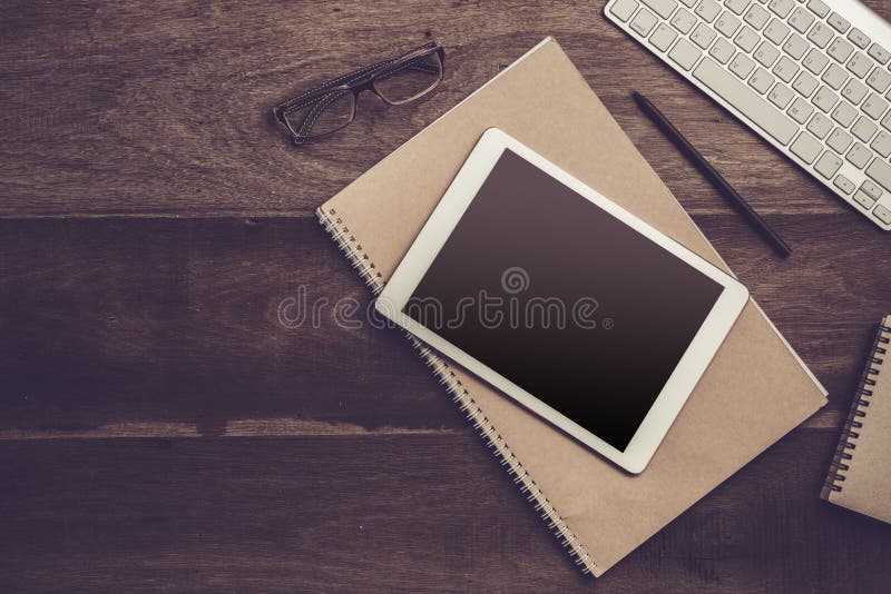 White Tablet with Blank Screen on Wooden Desk with Stationery Objects ...