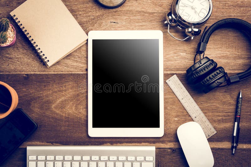 White Tablet with Blank Screen on Wooden Desk with Stationery Objects ...