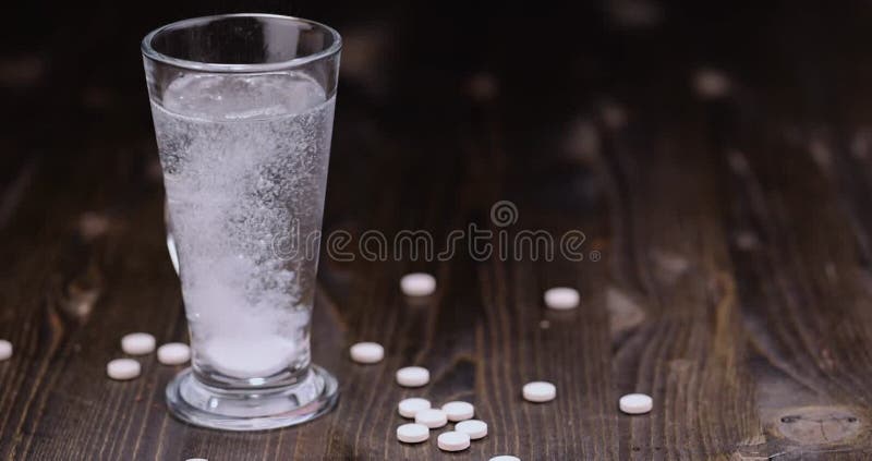 The White Tablet Dissolves in a Glass of Water Stock Video - Video of ...