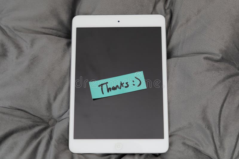 A White Tablet with a Note on it that Says THANKS Stock Photo - Image ...