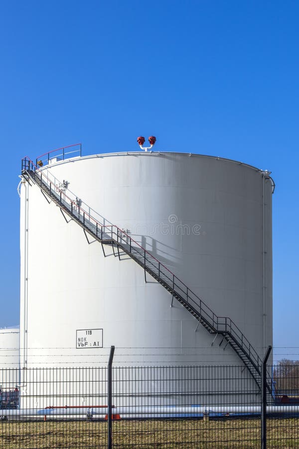 White tank in tank farm stock photo. Image of ladder - 25098304