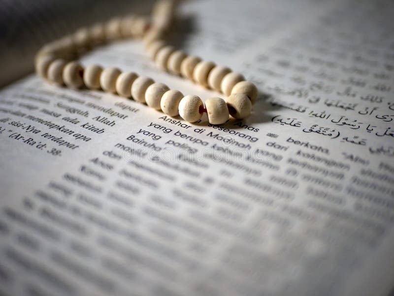 White Prayer Beads on an Islamic Book, Selected Focus Stock Photo ...