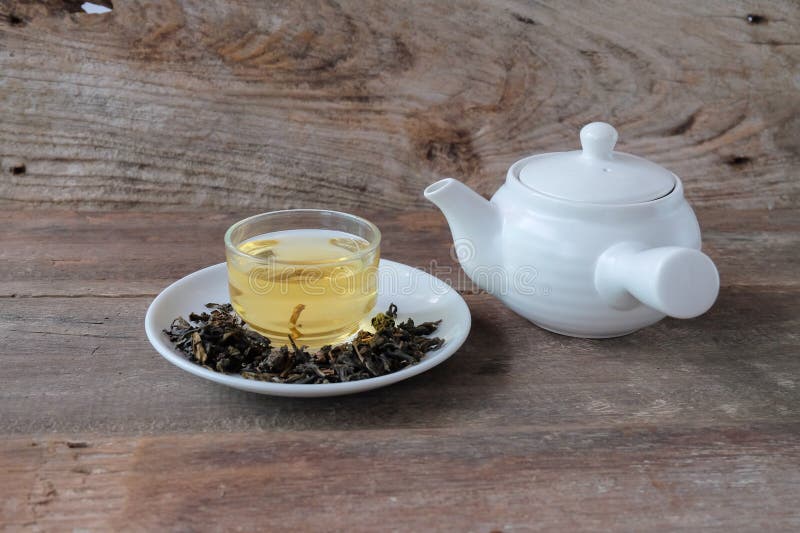 White Tea Pot and Cups of Hot Beverage Stock Photo - Image of green ...