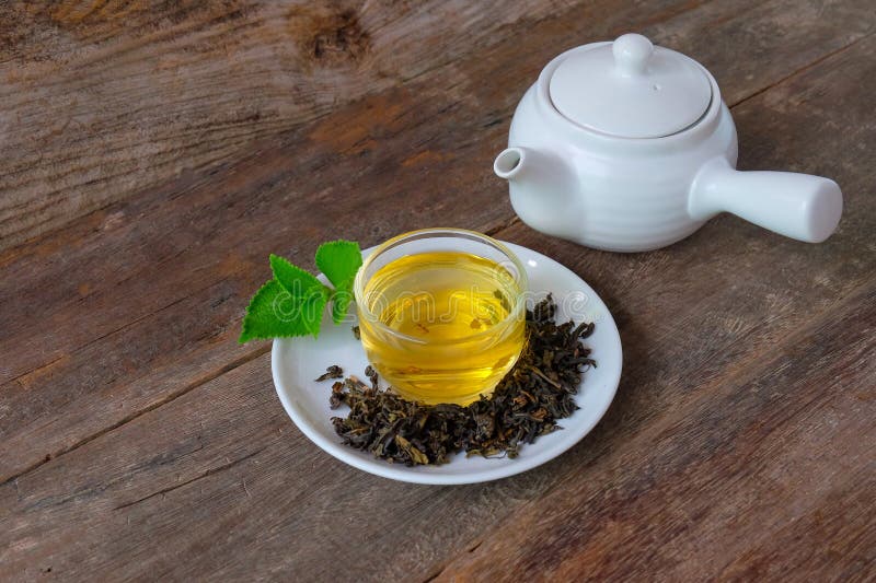 White Tea Pot and Cups of Hot Beverage Stock Photo - Image of green ...