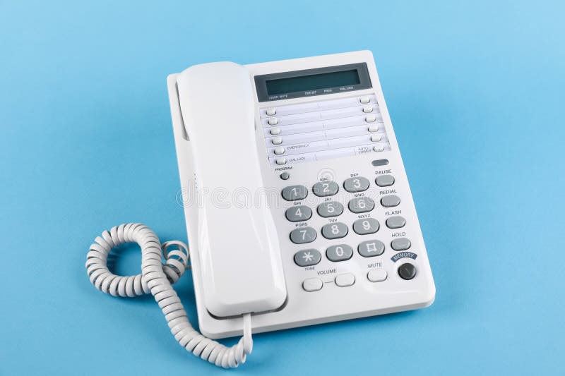 White Telephone with Handset on Light Blue Background Stock Image ...
