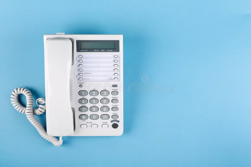 White Telephone with Handset on Light Blue Background, Top View. Space ...