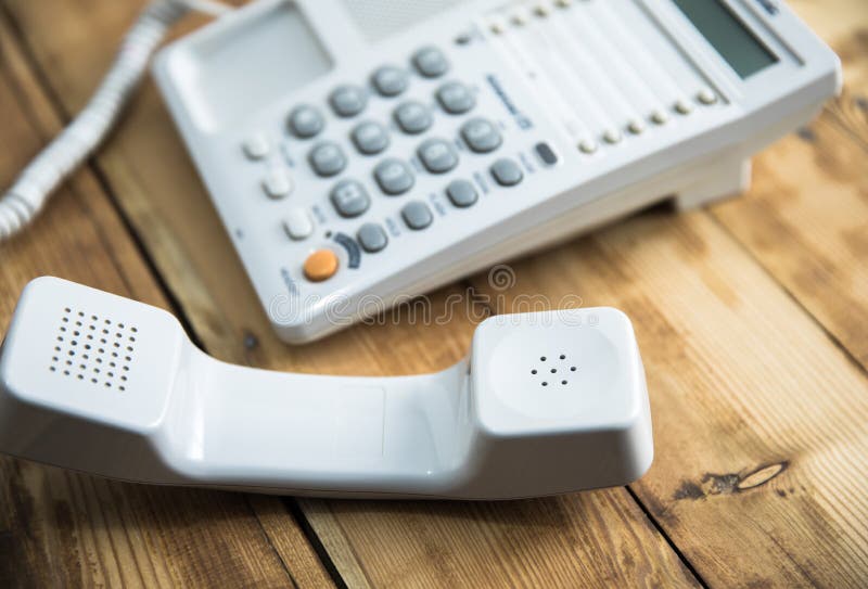 White telephone on table stock photo. Image of connection - 193246870