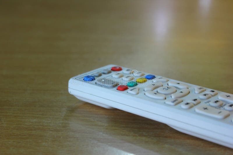 A White Television Remote Control on a Wooden Background Stock Image ...