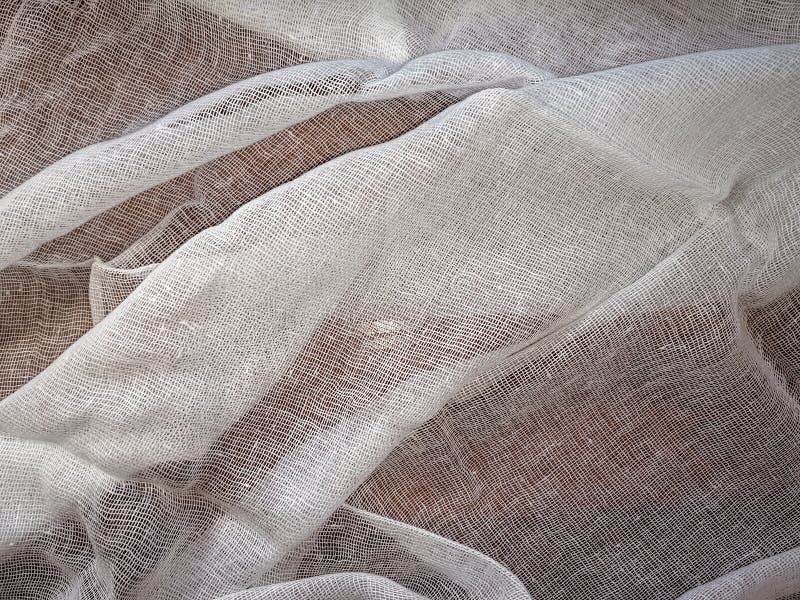 White Texture of Medical Gauze Lying Wavy on a Brown Surface Stock ...