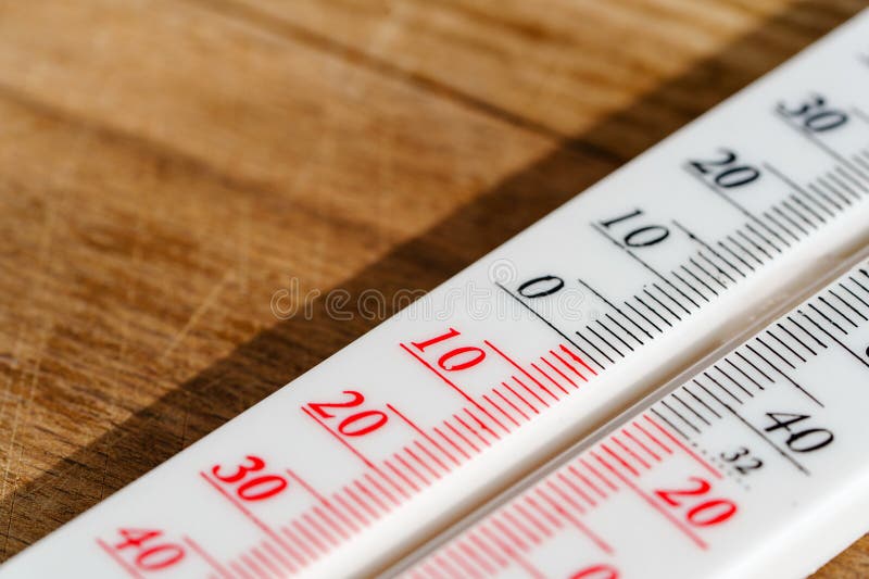 White Thermometer on Wooden Surface Showing a Temperature of 15 Degrees ...