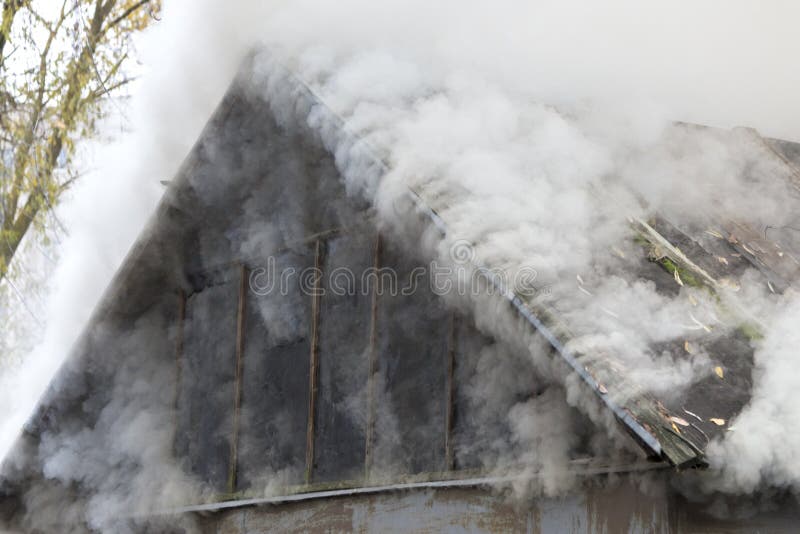 White Smoke Comes from the Burning Roof of the House Stock Photo ...