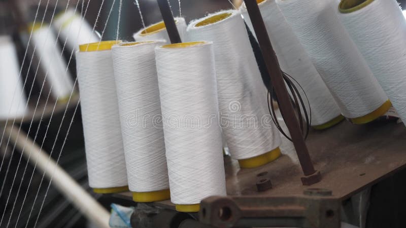 Spools of White Thread on a Spinning Machine in a Textile Mill Stock ...