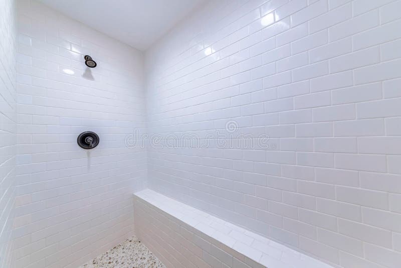 White-tiled Shower Area with a Sitting Space Stock Image - Image of ...