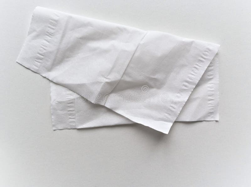 A White Tissue is Folded in Half and Laying on a White Surface Stock ...