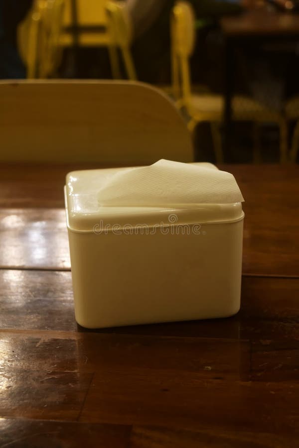 A White Tissue Holder is on a Wooden Table Stock Image - Image of ...