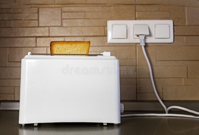 White Toaster with Toasted Slice of Bread in the Kitchen. Horizontal ...