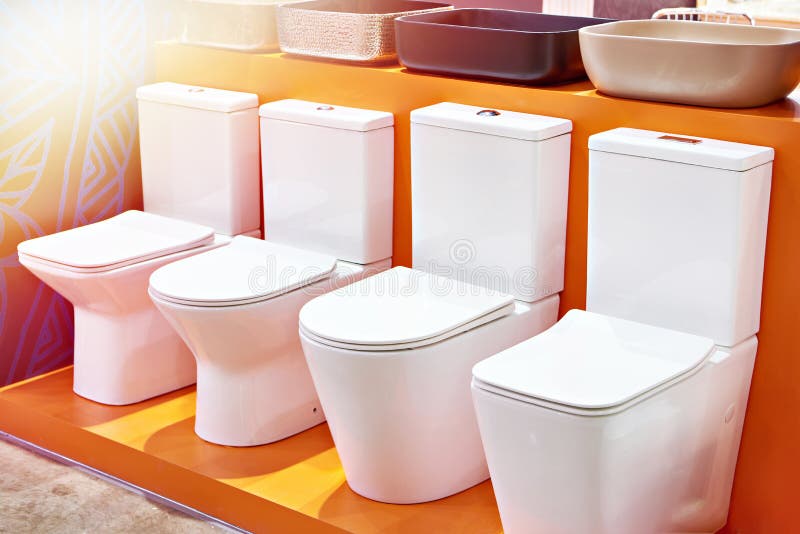 White toilet bowls in shop stock image. Image of home - 254214567