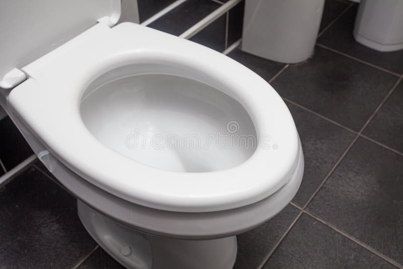 White Toilet Wc on Black Tiles Closeup Stock Photo - Image of room ...