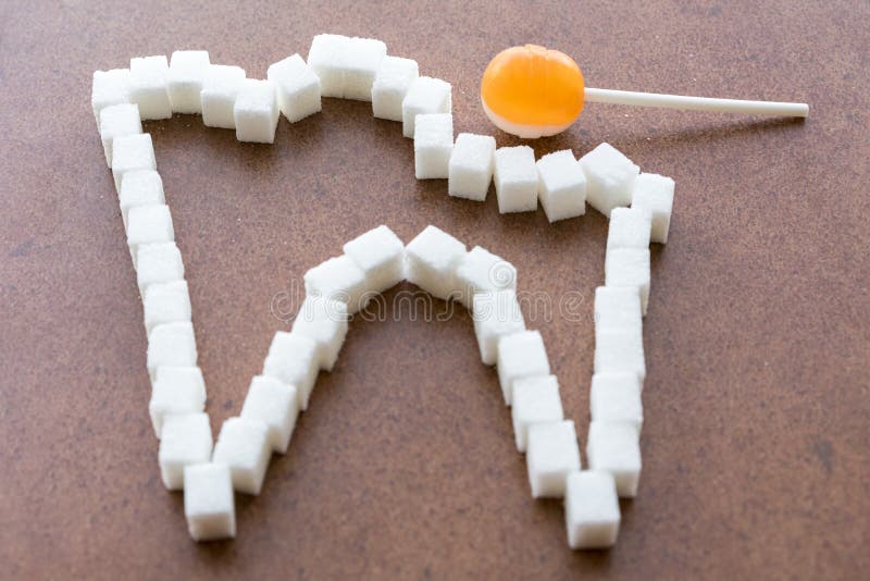 White Tooth with Caries from Candy on a Stick Stock Image - Image of ...