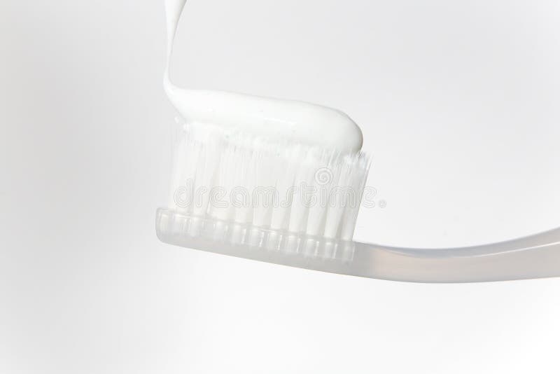 White Toothpaste on the Toothbrush Bright Closeup. Stock Photo - Image ...