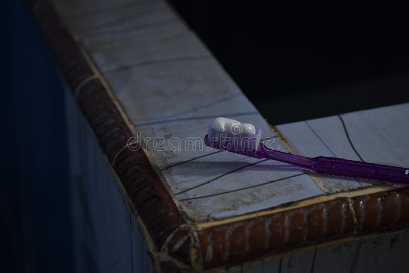 White Toothpaste on Toothbrush in Dark Bathroom. Stock Image - Image of ...