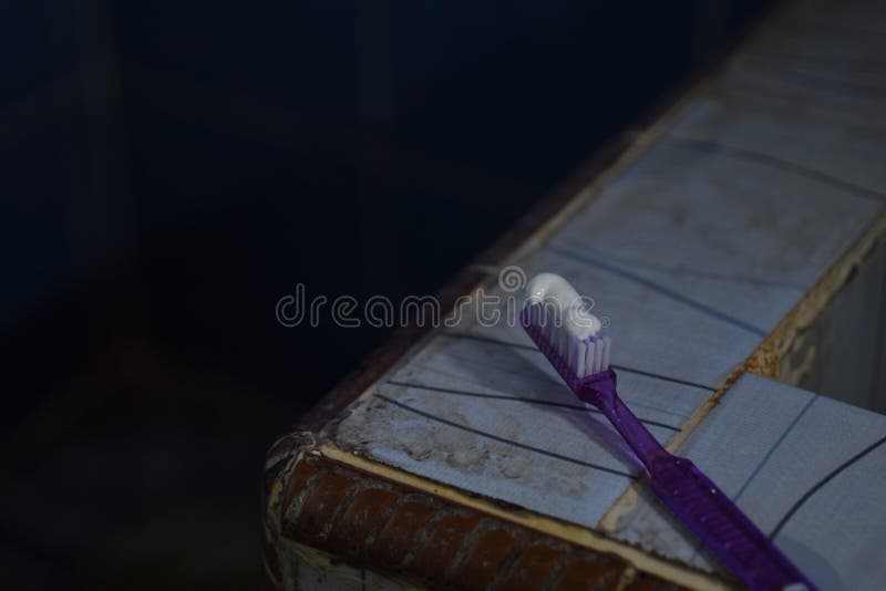 White Toothpaste on Toothbrush in Dark Bathroom. Stock Image - Image of ...