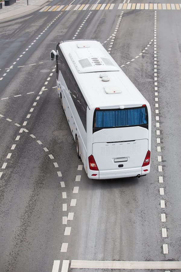 White Tourist Bus at the Intersection Stock Photo - Image of service ...