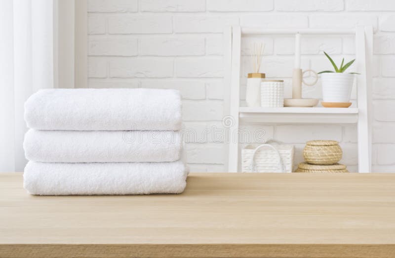 White Towel Stack on Wooden Table in Bathroom with Space Stock Photo ...
