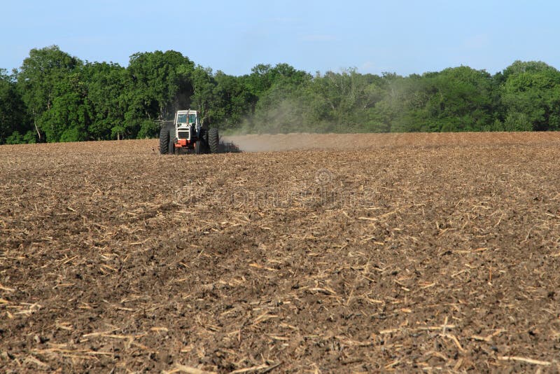 White Tractor Tilling Field Stock Photo - Image of resources, small ...