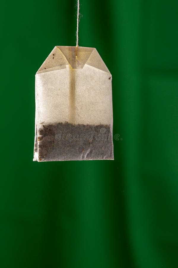 White Translucent Tea or Infusion Sachet on Green Color Background ...