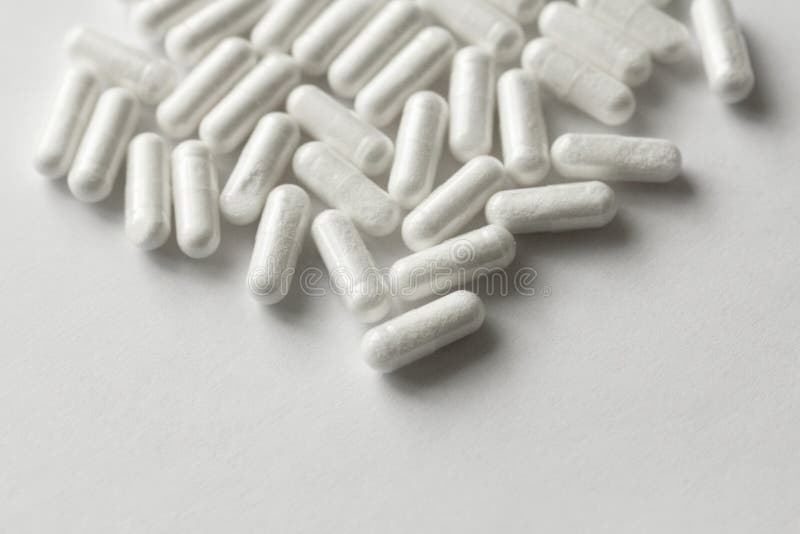 White Transparent Capsules Or Tablets On The White Background. M Stock ...