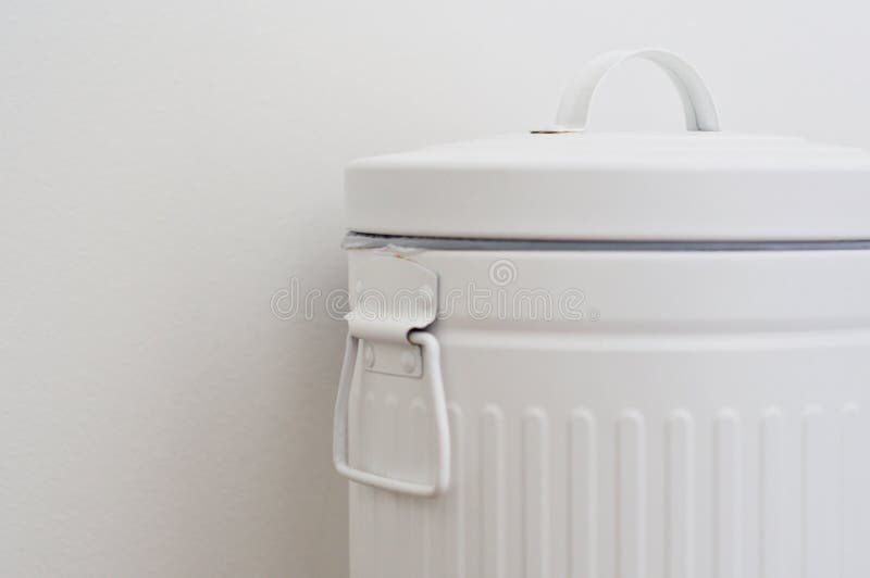 White Trash Can with Copy Space on White Wall. Trash Bin Stock Image ...