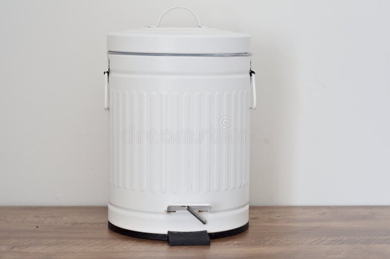 White Trash Can with Copy Space on White Wall. Trash Bin Stock Image ...