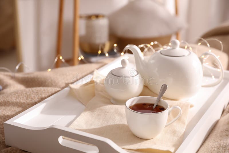 White Tray with Ceramic Tea Set on Bed Stock Image - Image of house ...