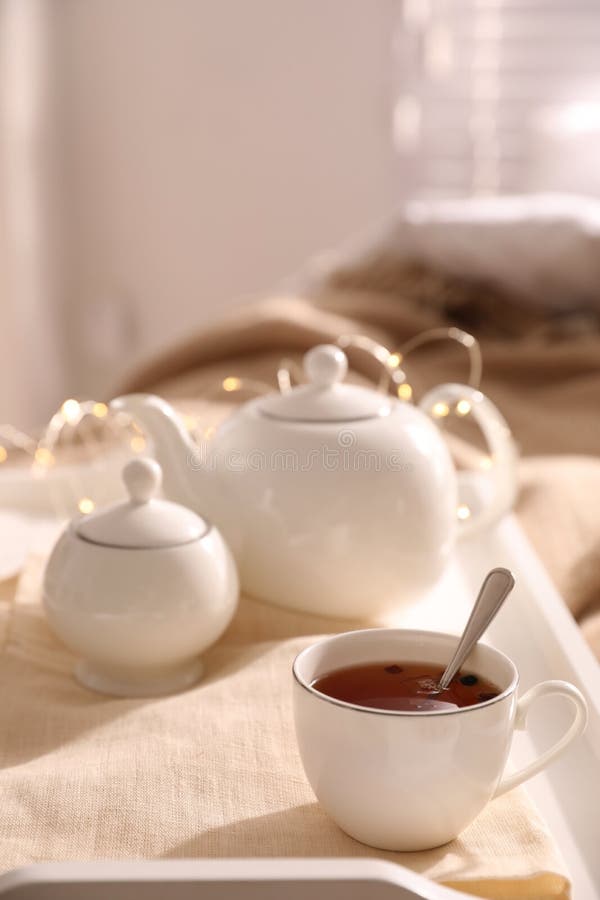 White Tray with Ceramic Tea Set on Bed Stock Photo - Image of fashion ...