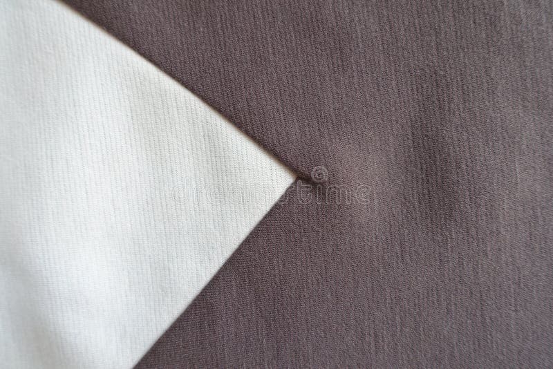 White Triangular Gusset Sewn To Brown Fabric Stock Image - Image of ...