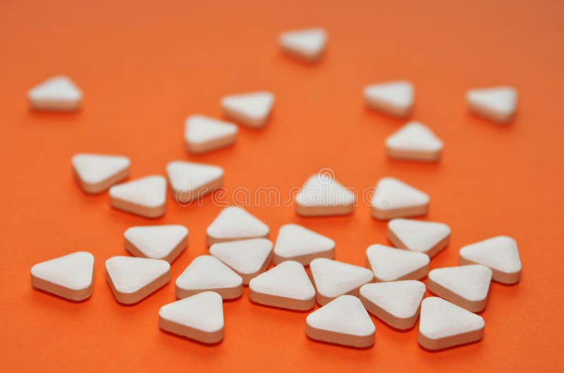 White Triangular Unusual Tablets are Laid in the Shape of a Triangle on ...