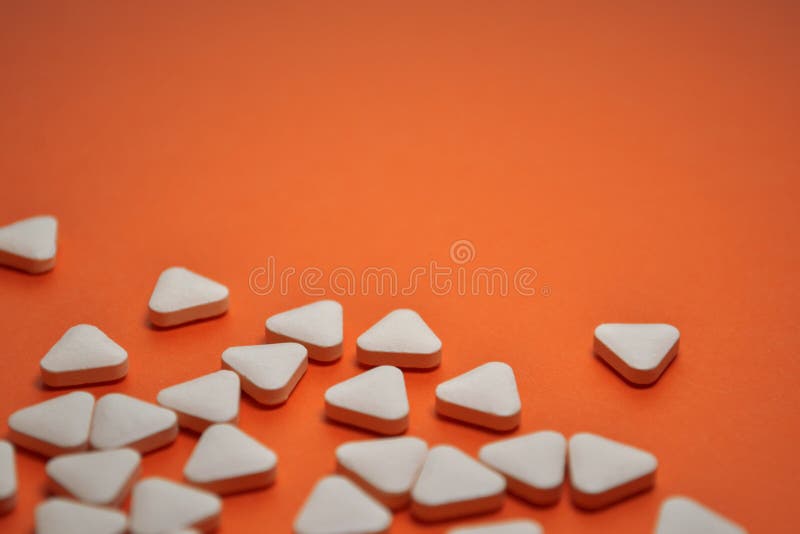 White Triangular Unusual Tablets are Laid in the Shape of a Triangle on ...