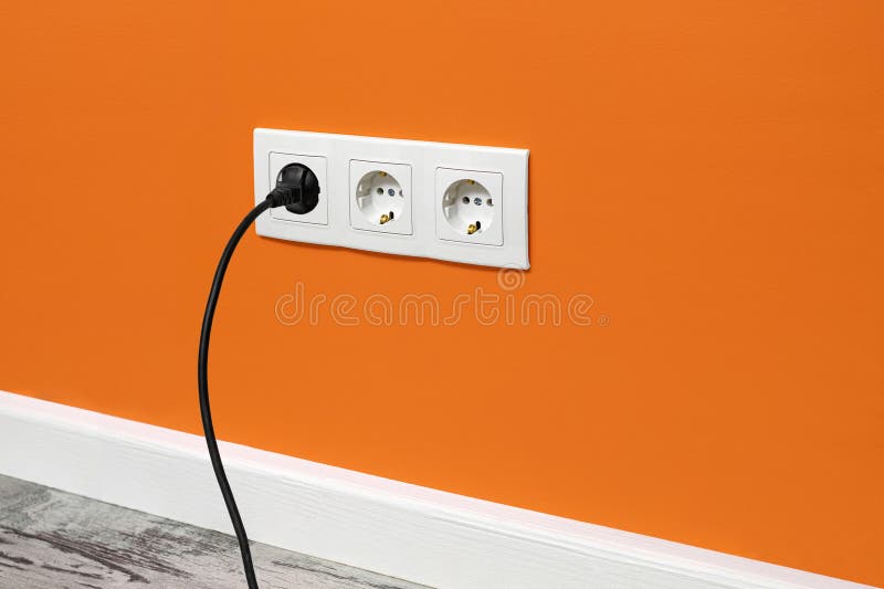 White Triple Outlet on Orange Wall Stock Image - Image of planning ...