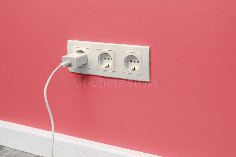 White Triple Outlet on Pink Wall Stock Image - Image of electric ...