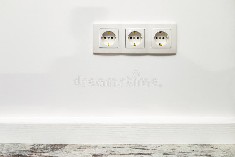 White Triple Outlet on White Wall Stock Image - Image of home, people ...