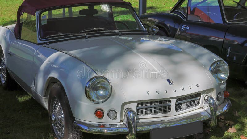 White Triumph Spitfire Car Parked on Grass on a Sunny Day Stock Footage ...