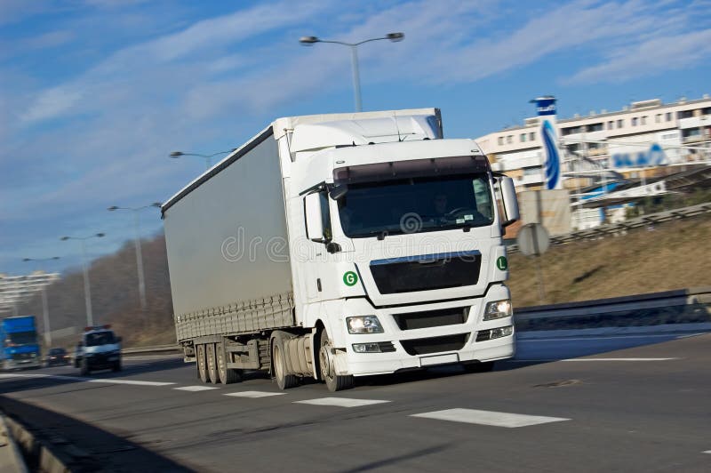 White Truck Driving Fast stock image. Image of driving - 7830875