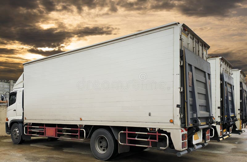 A White Trucks Container on Parking at Sunset Sky. Logistics and ...